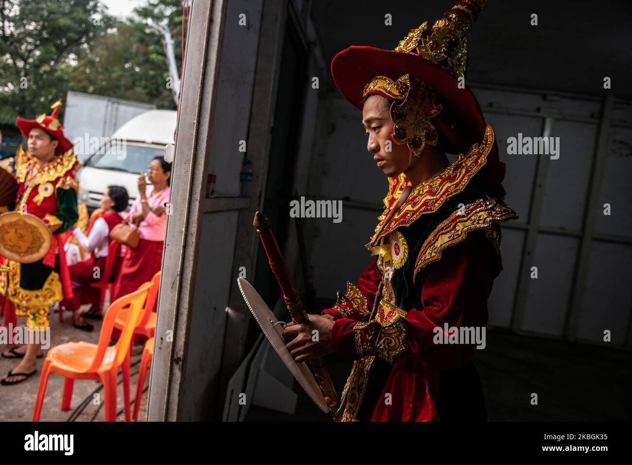 A dancer prepares backstage during the 73rd Mon National Day ...