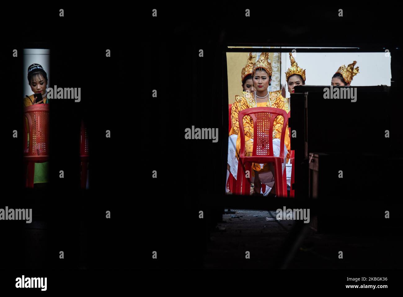 Dancers wait at backstage during the 73rd Mon National Day celebration ...