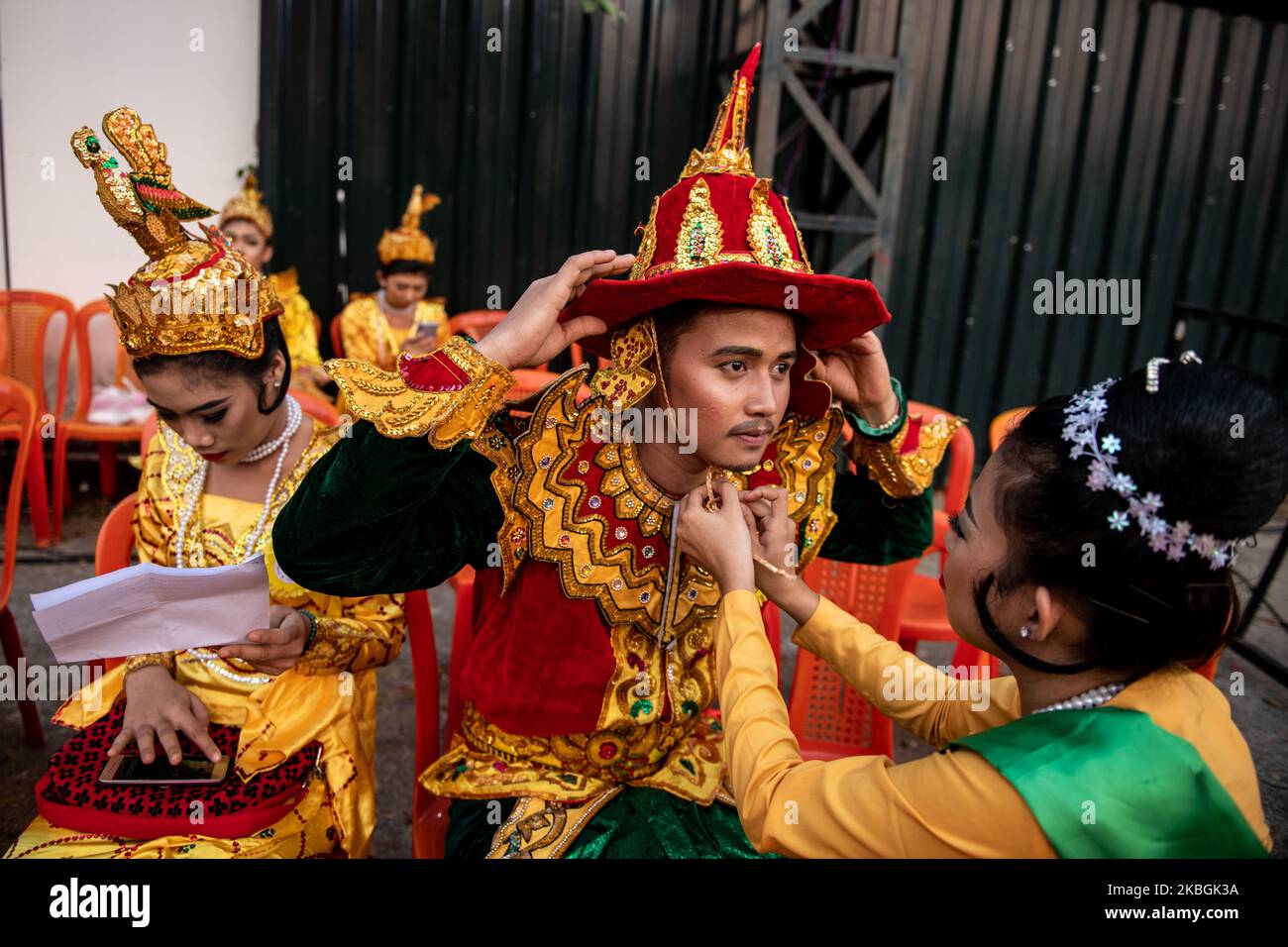 Dancers prepare backstage during the 73rd Mon National Day celebration ...