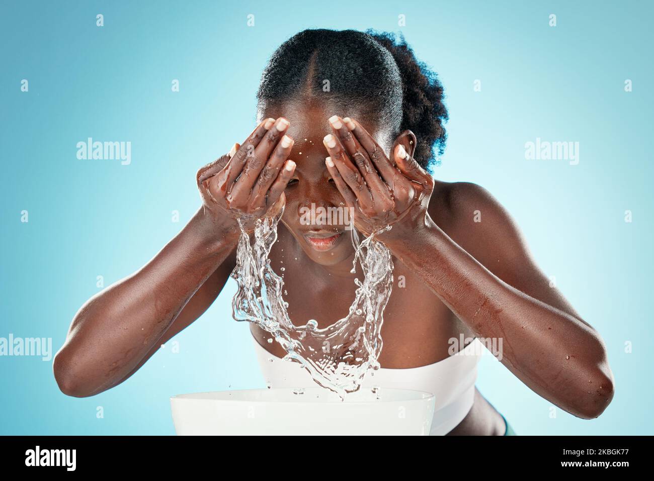 Woman, water splash and face cleaning, wellness and body hygiene for ...