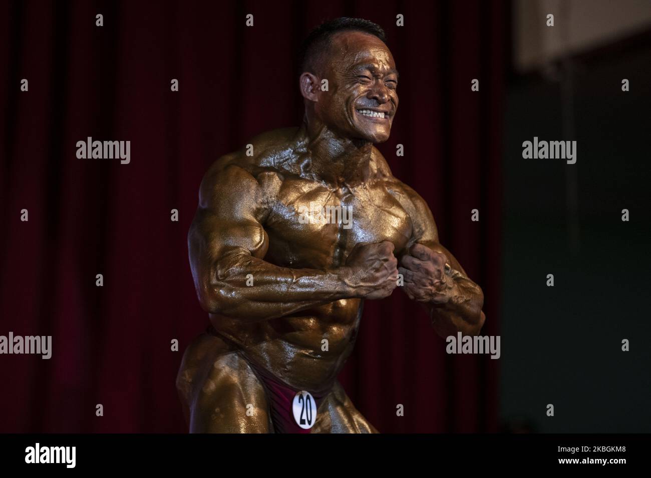 Male bodybuilding athlete competes in the Myanmar National Championship ...