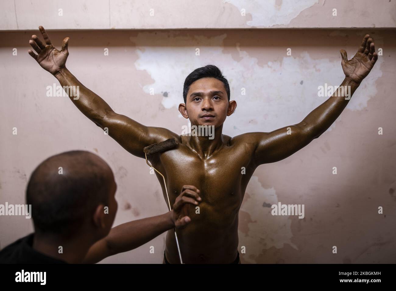 Male bodybuilding athlete prepares backstage to compete in the Myanmar ...