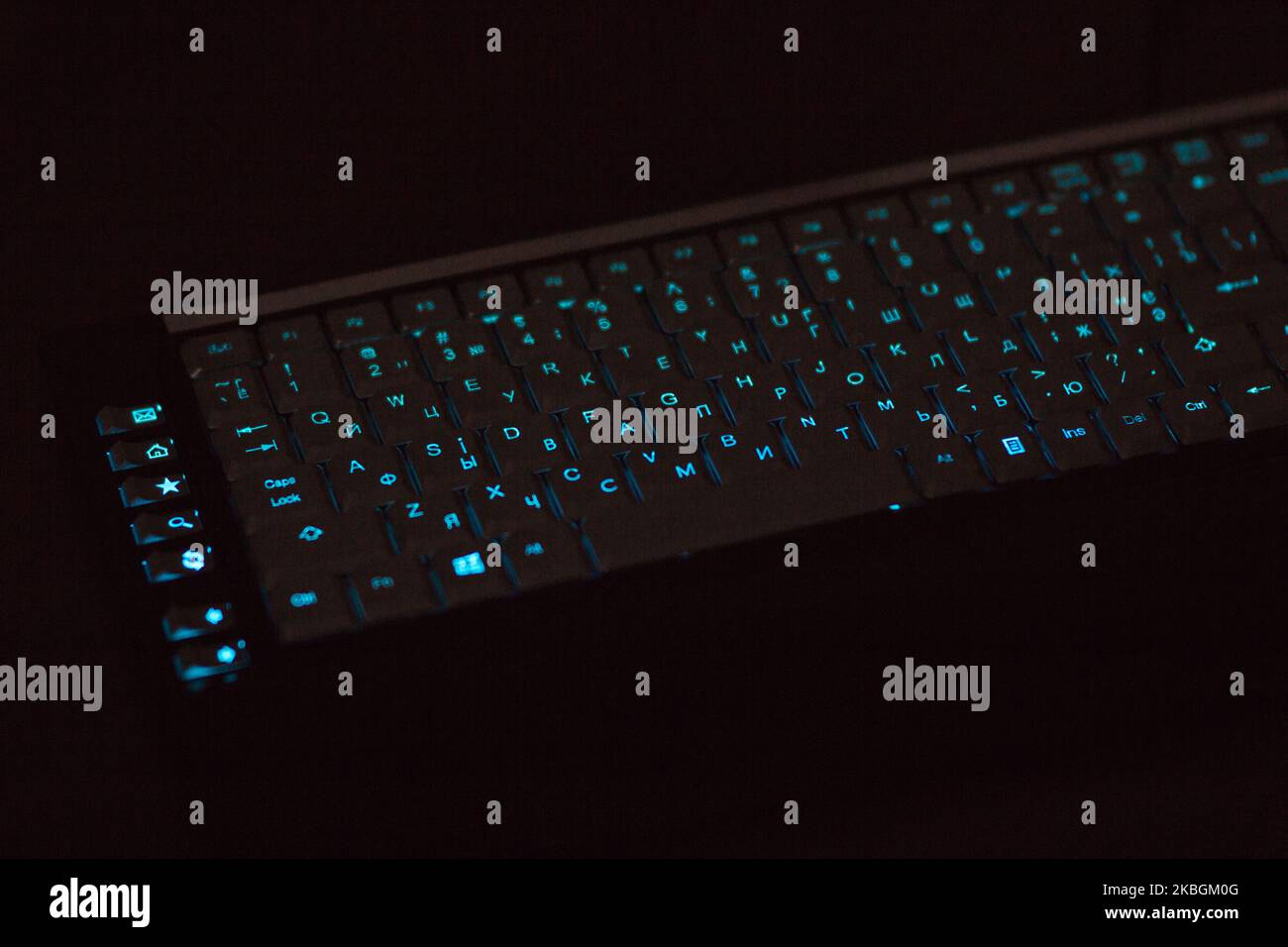 keyboard buttons glowing at night on black background Stock Photo - Alamy
