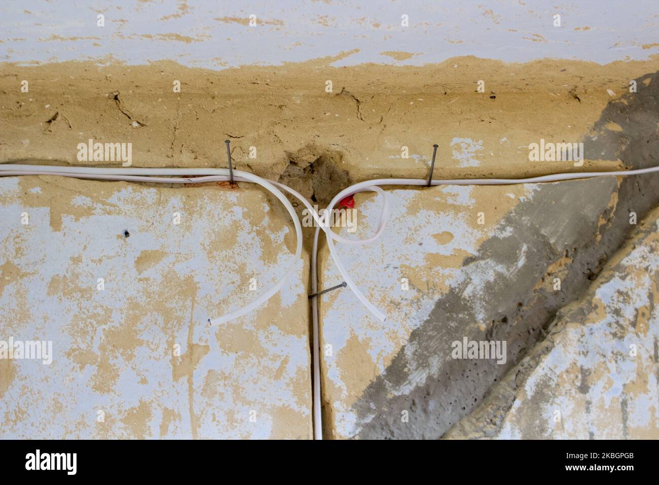 room laying electric wires in the wall Stock Photo - Alamy