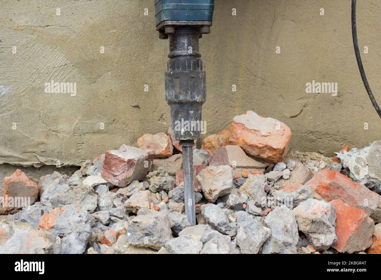 on a pile of brick close up drill punch Stock Photo - Alamy