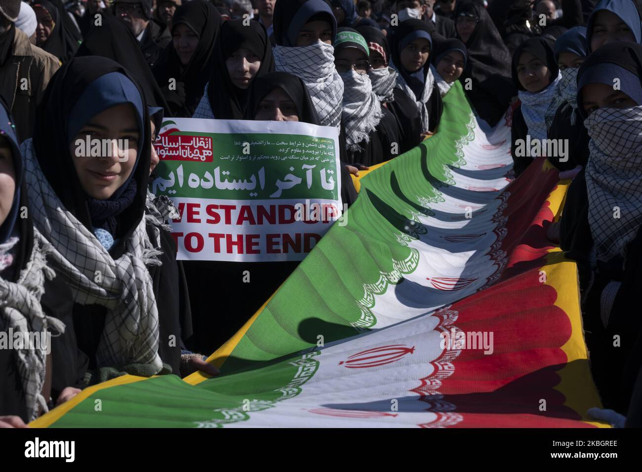 Iranian schoolgirls carrying an Iran flag during a rally to mark the ...