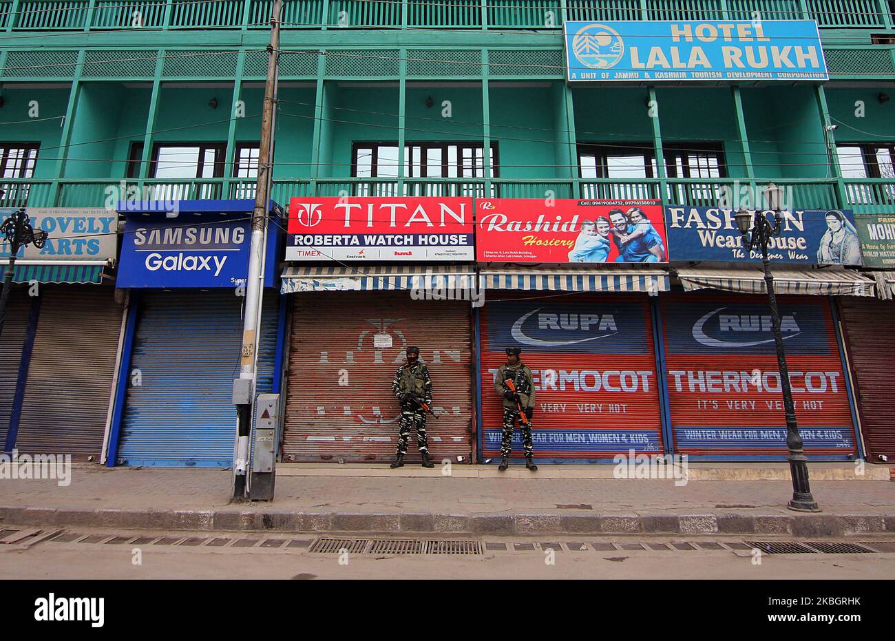Indian paramilitary soldiers stand guard during a shutdown in Srinagar ...