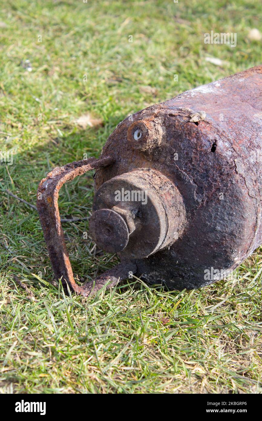 rusty fire extinguisher lying on the grass close up Stock Photo - Alamy