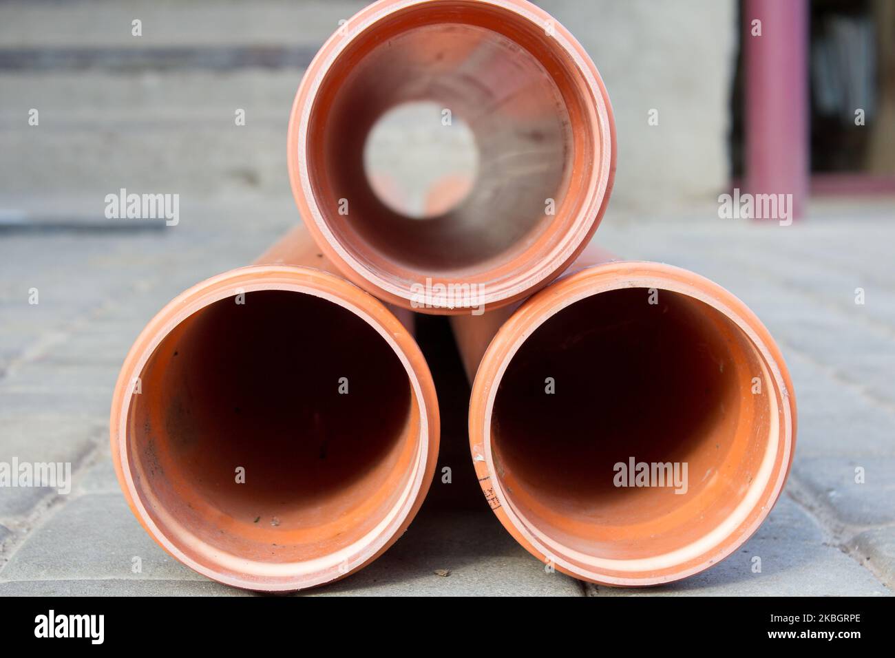 New sewer pipes are front view on the pavement Stock Photo - Alamy