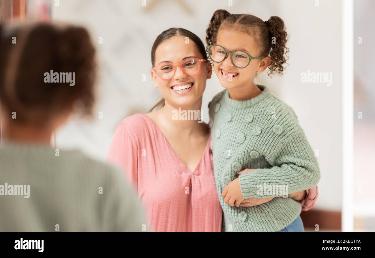 Family, optics store and shopping with mother and child looking at ...