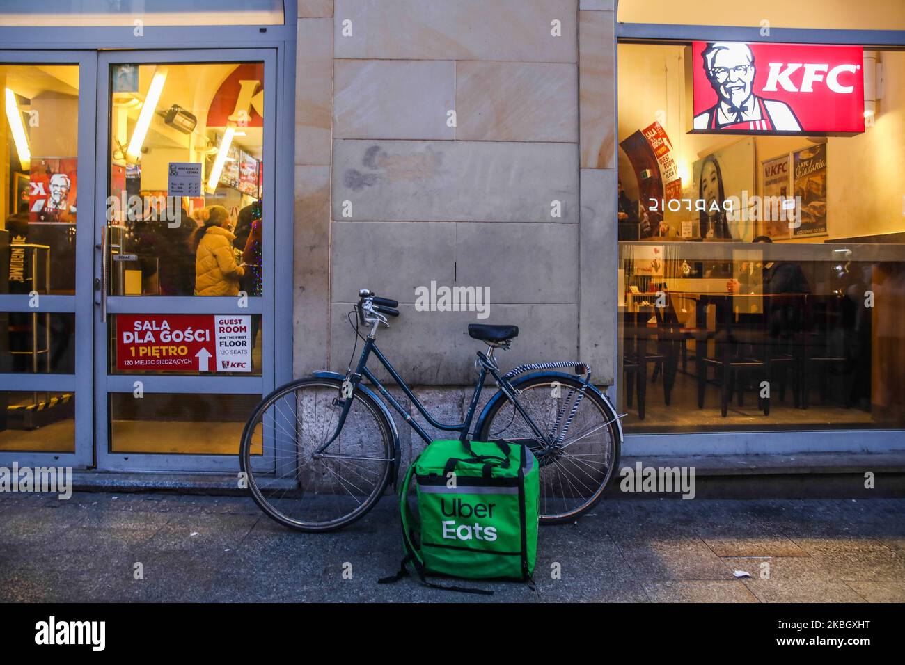 Uber Eats bag and a bike are seen in front of KFC restaurant in Krakow, Poland on February 9 ...