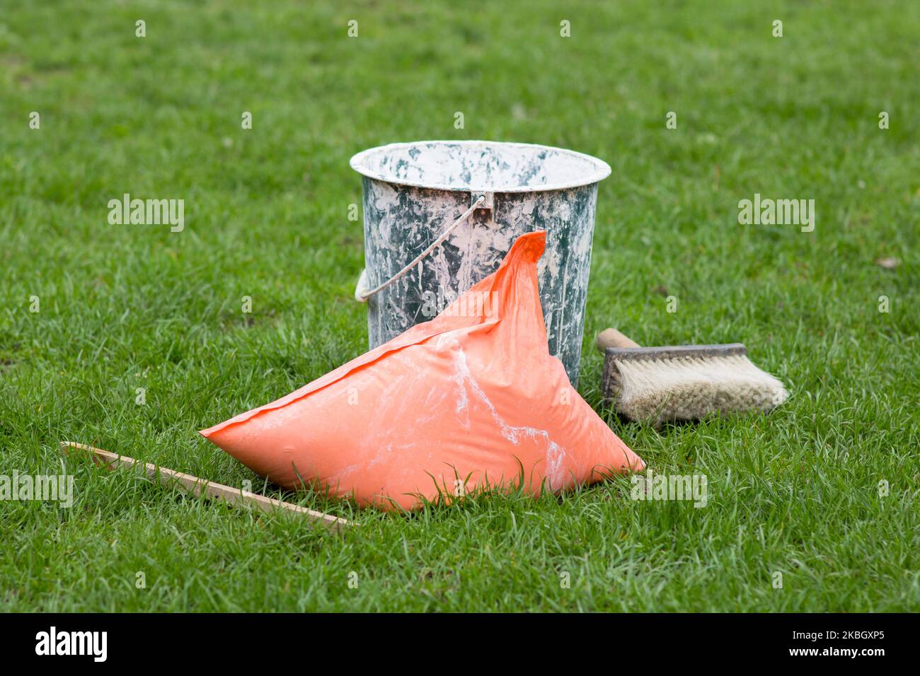 bucket of lime for whitewashing the grass and brush Stock Photo - Alamy