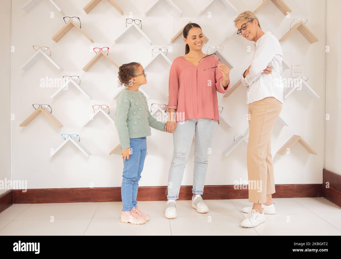 Glasses, vision and retail store with mother and child shopping for ...