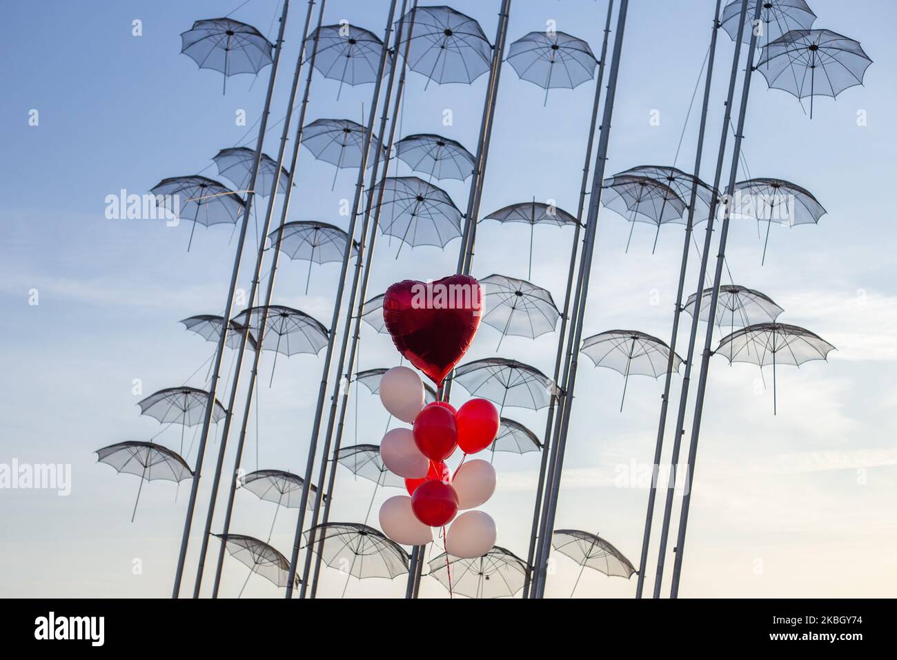 Umbrellas and air balloons with haert are seen in downtown of ...