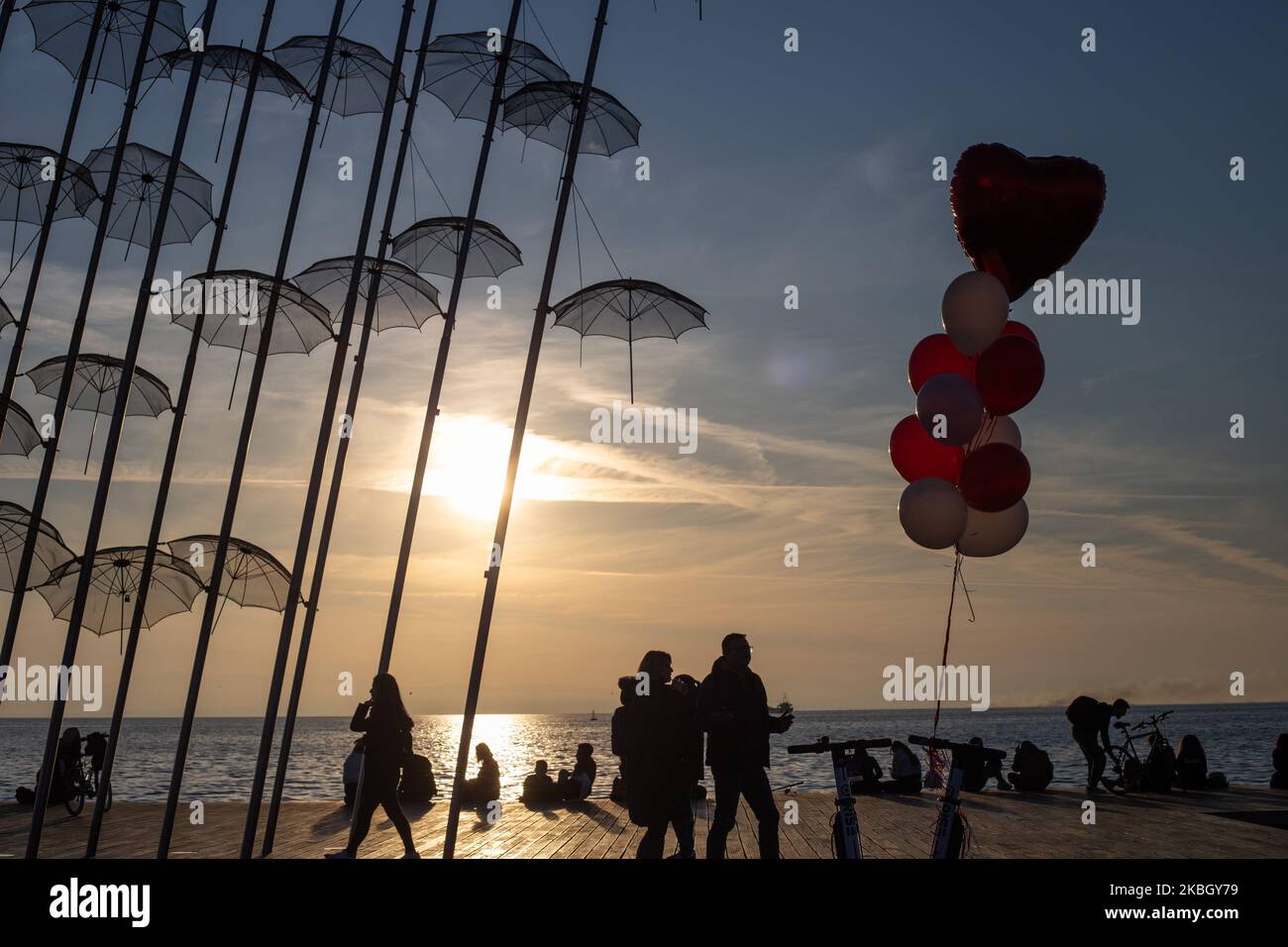Umbrellas and air balloons with haert are seen in downtown of ...