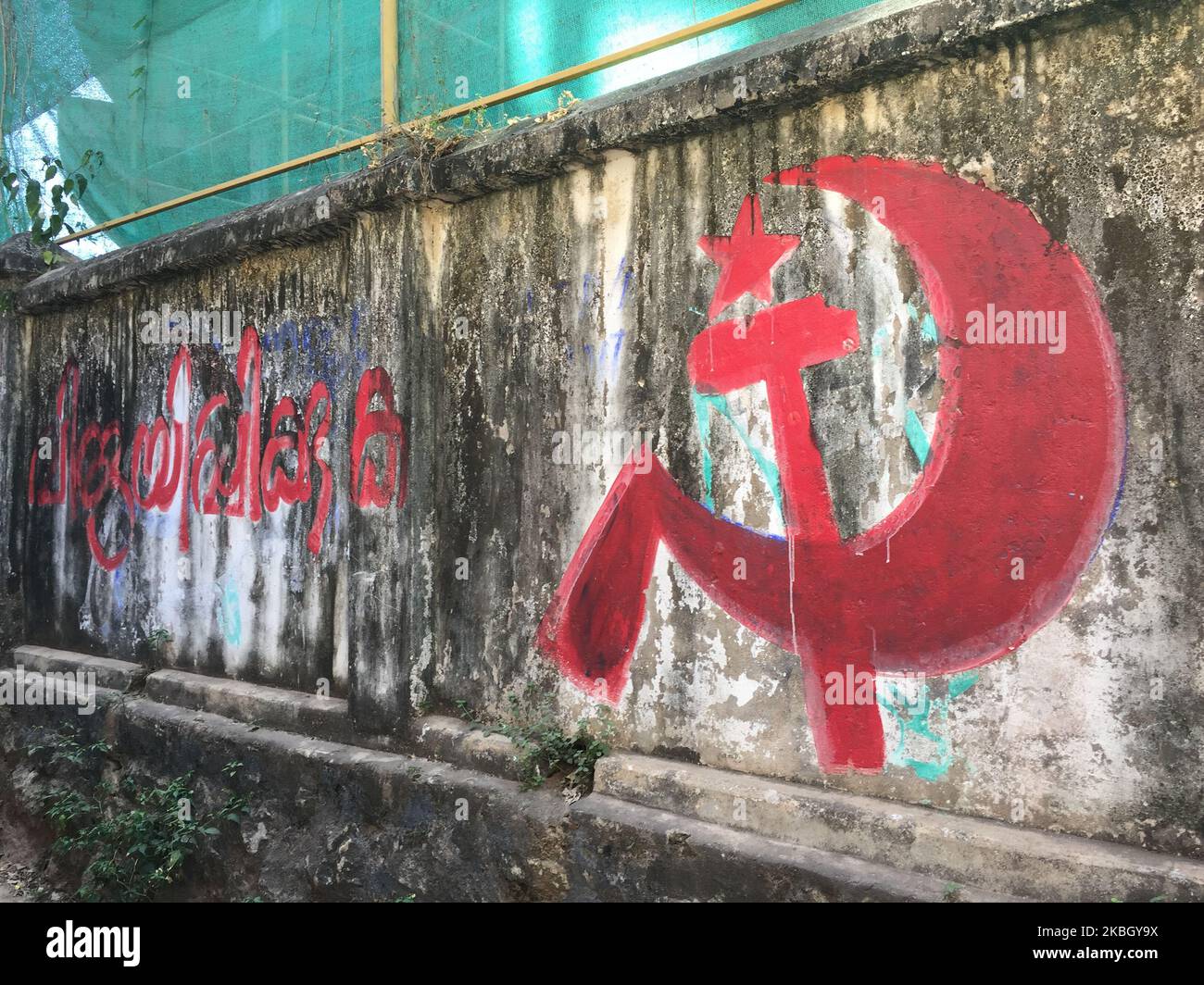 Political messages from one of the communist parties written on a wall ...