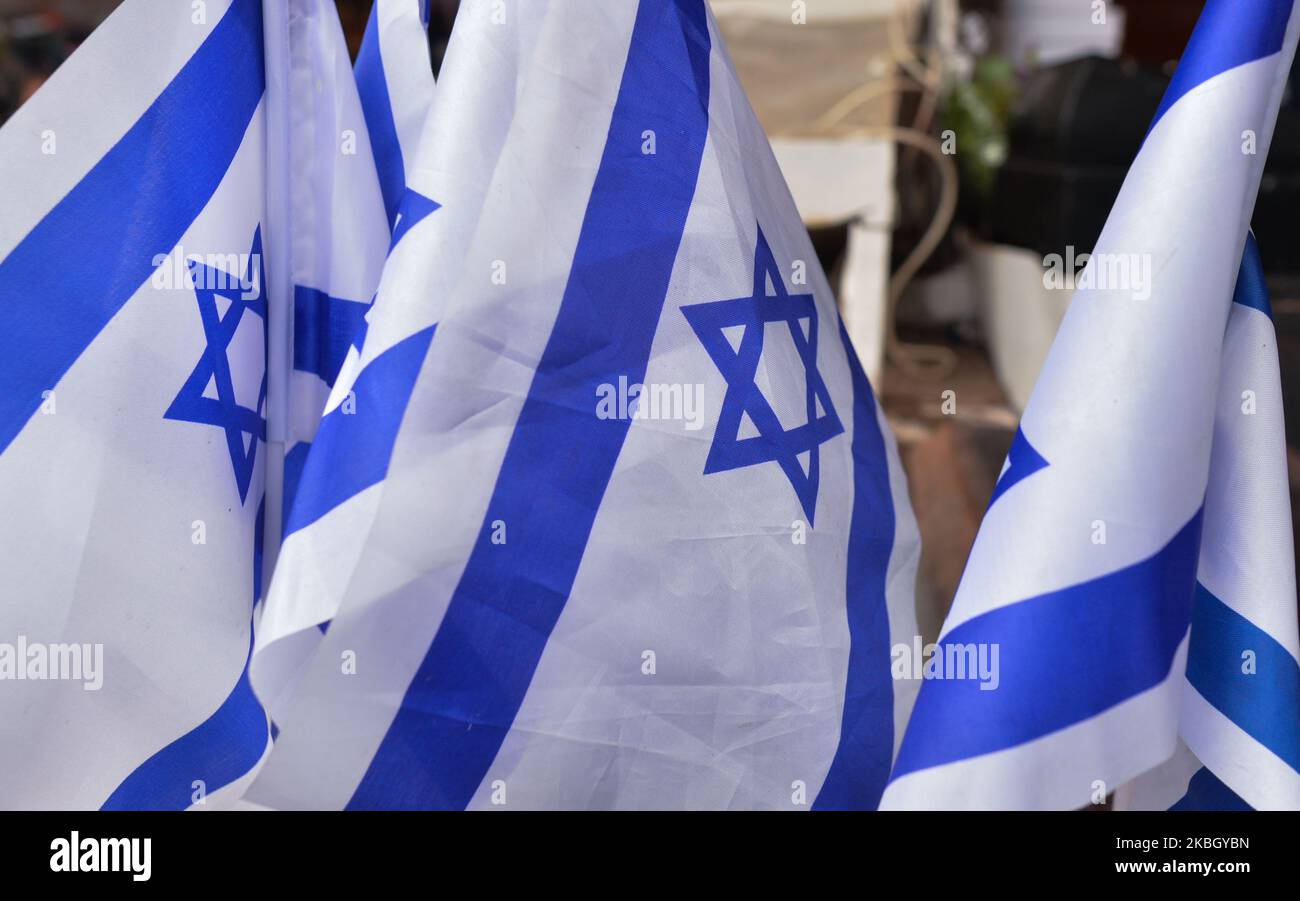 Israeli flags on display at Carmel Market, in Tel Aviv. On Monday, 10 ...