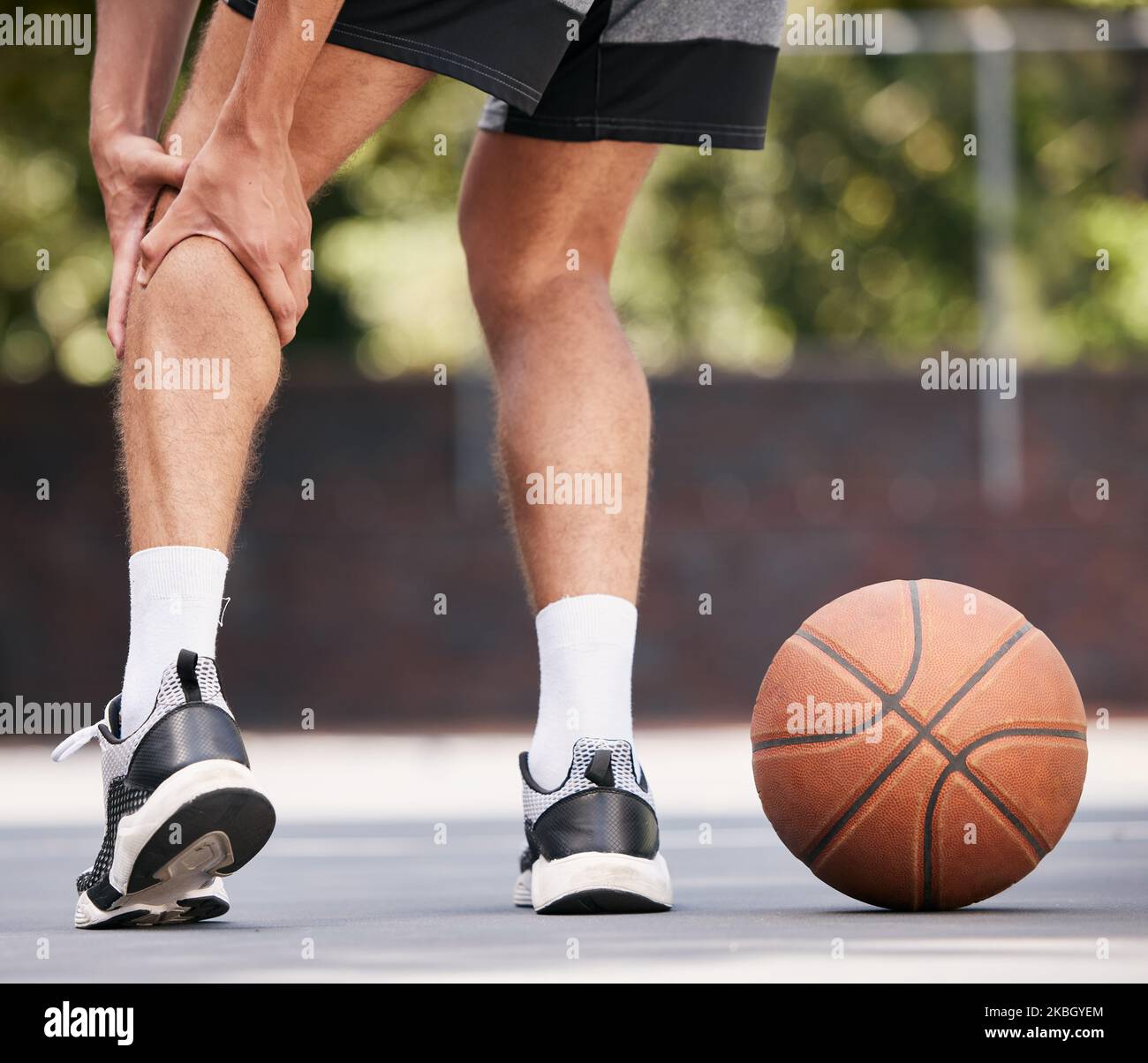 Man legs, injury and basketball athlete in pain on court for fitness ...