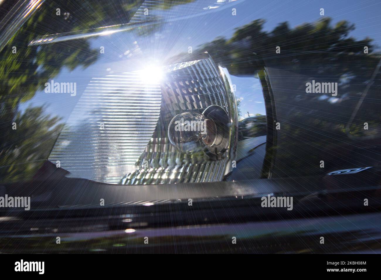 beautiful automobile headlight closeup with sun rays Stock Photo - Alamy