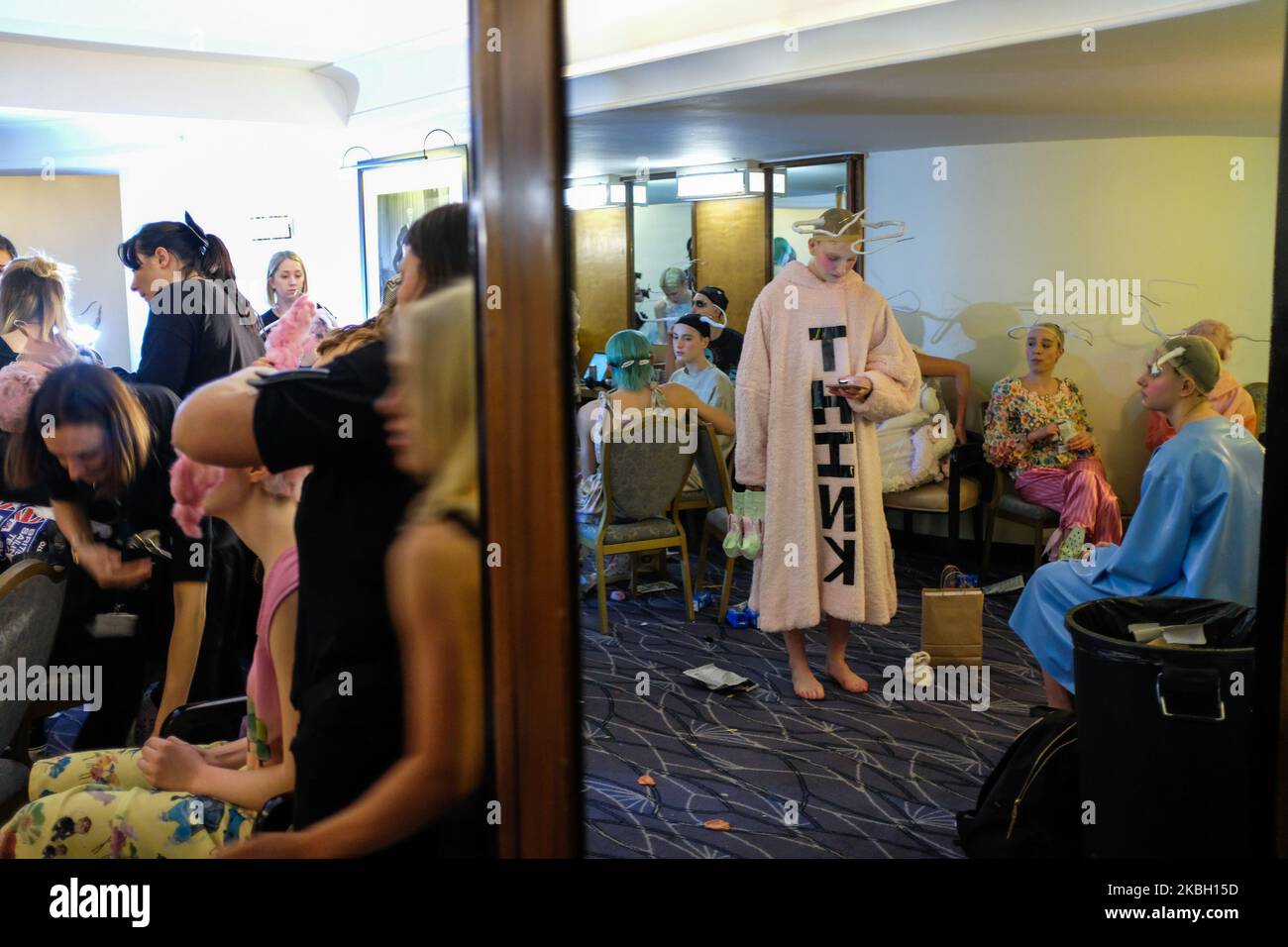 A model backstage at the VIN + OMI show during London Fashion Week at ...