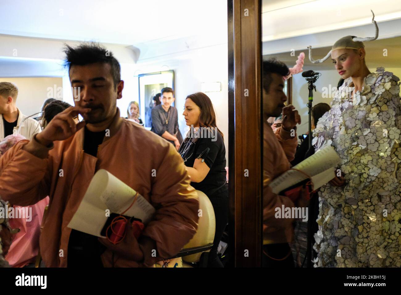 A model backstage at the VIN + OMI show during London Fashion Week at ...