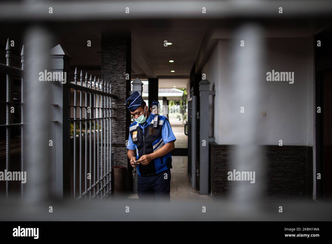 A guard from VIP airport guest prepare to open the VIP gate. Total of ...