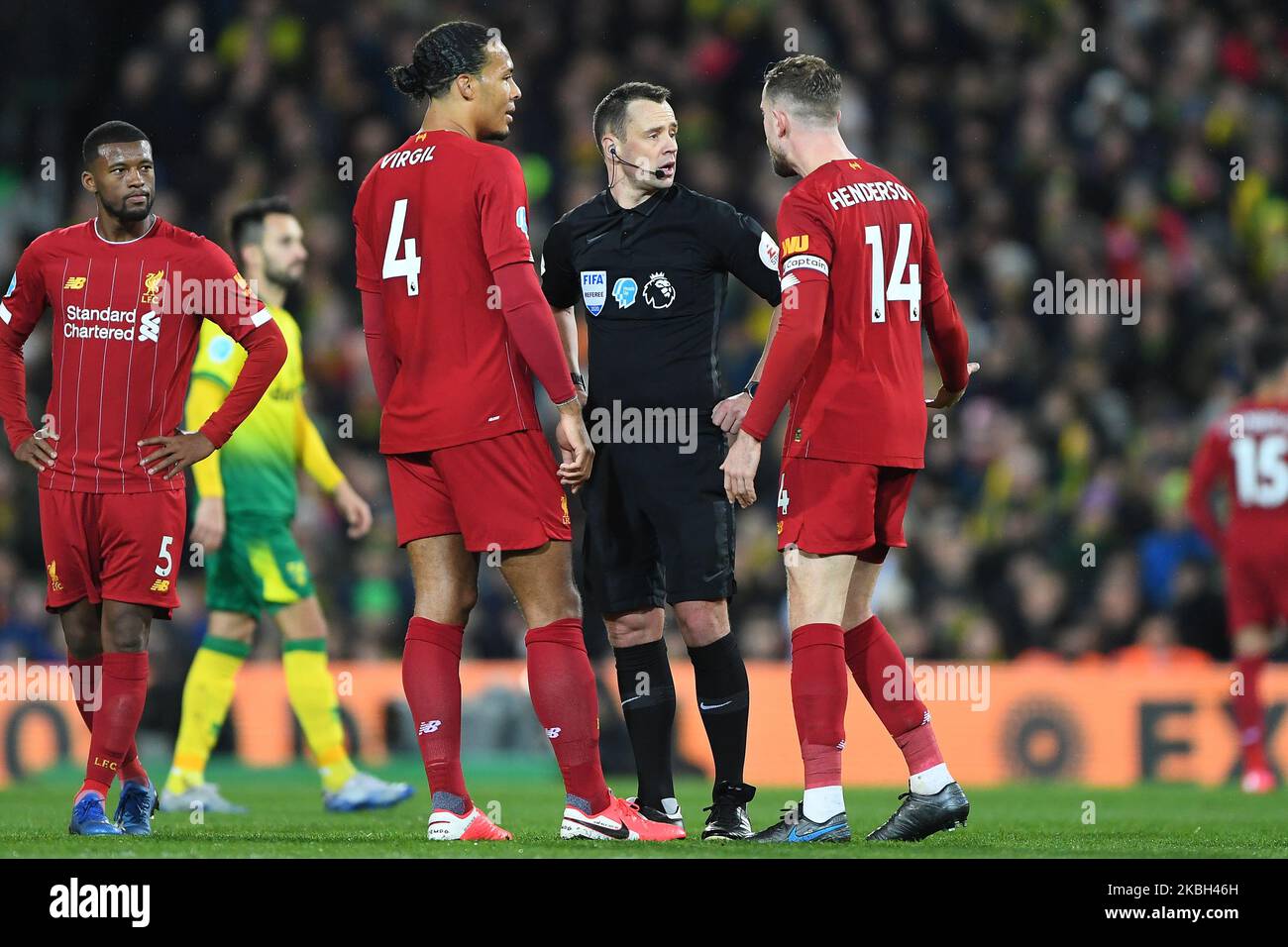 Referee Stuart Attwell has words with Jordan Henderson (14) of ...