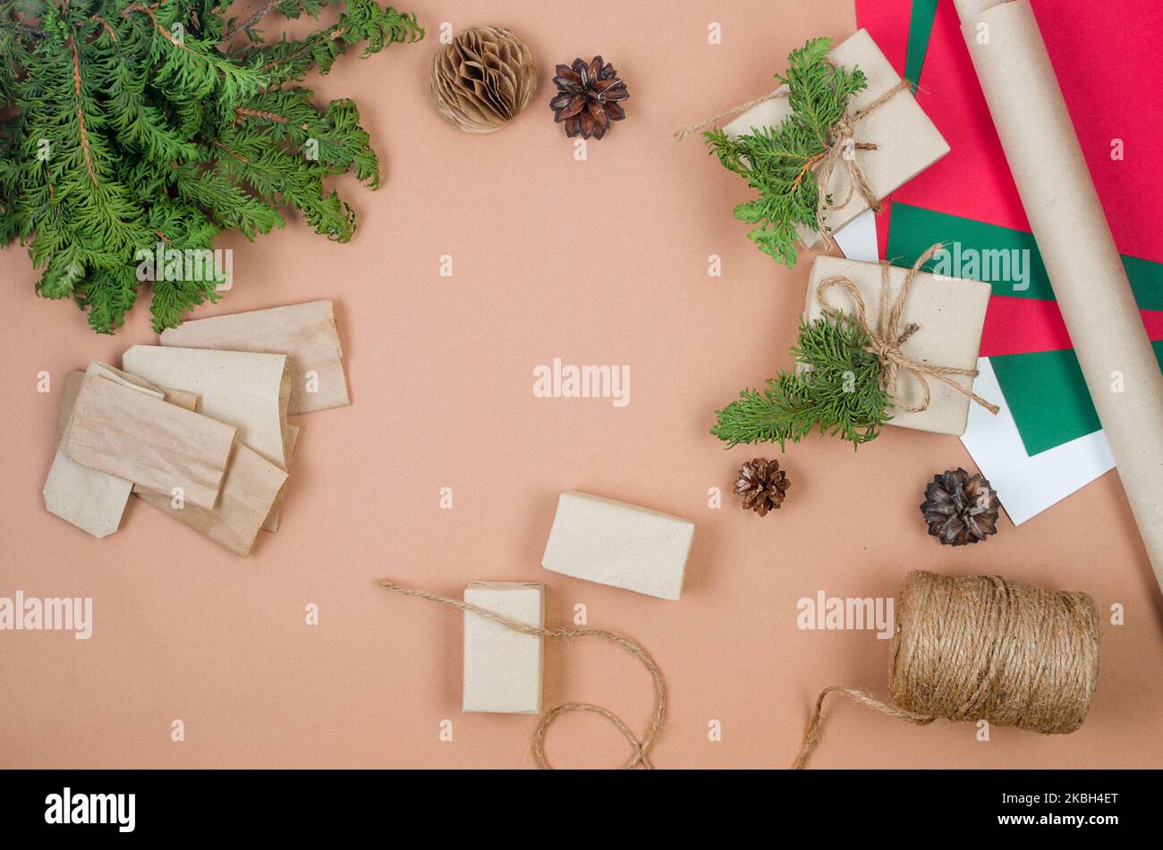 Christmas background with gift boxes wrapping in craft paper on beige ...