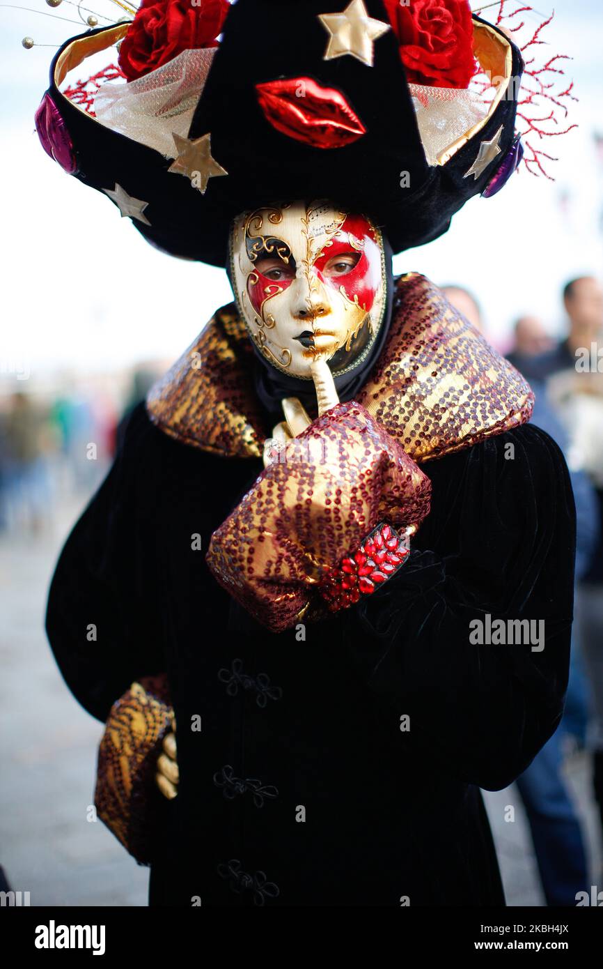 People wearing Carnival costume poses in front of Saint Mark's on ...
