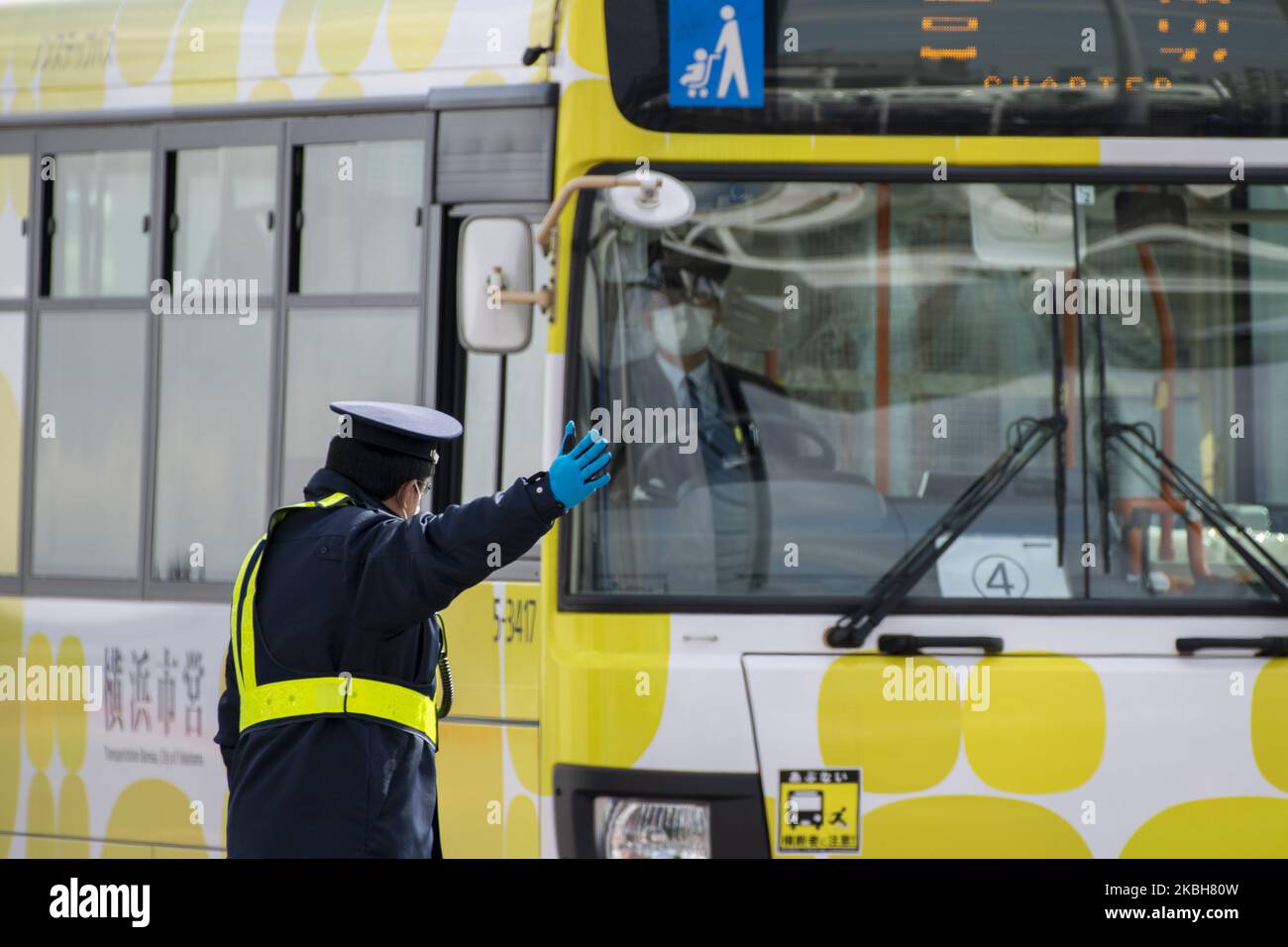 A bus believed to be carrying passengers from the cruise ship Diamond ...