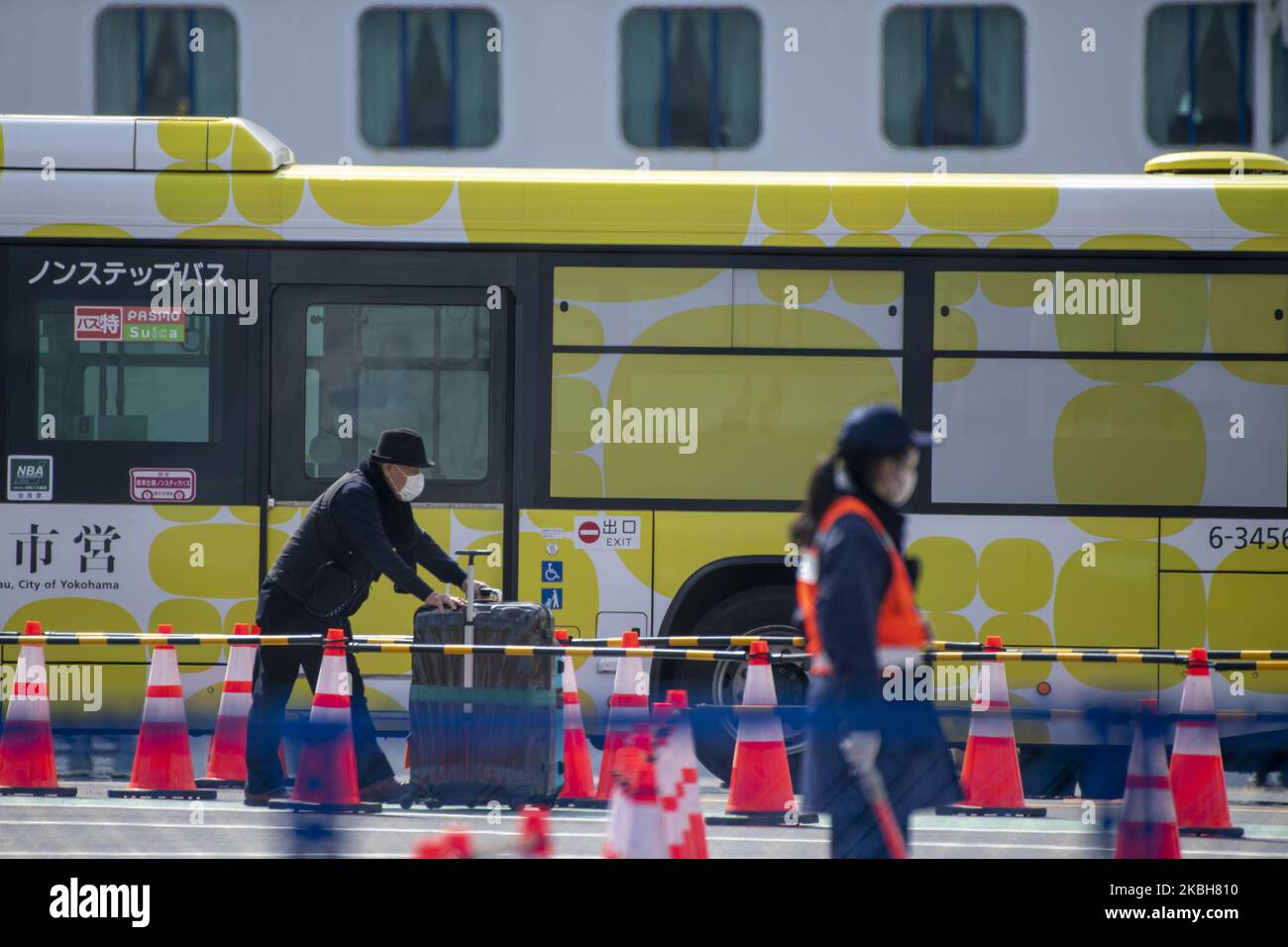 Passengers walk out from the cruise ship Diamond Princess at Daikoku ...