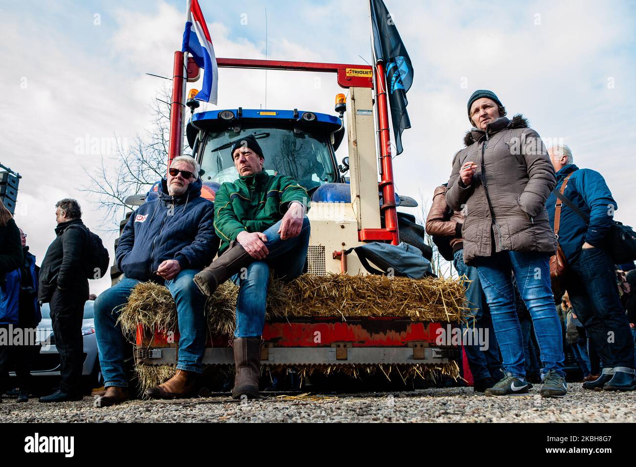 Some farmers are sitting over one of the tractors, during the new ...