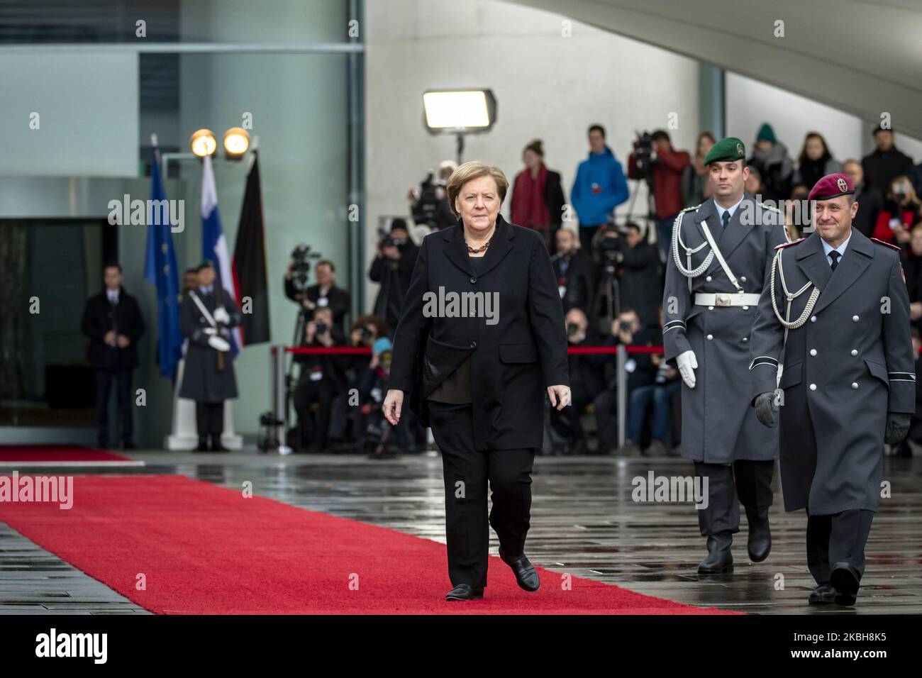 German Chancellor Angela Merkel arrives to congratulate a soldier for ...