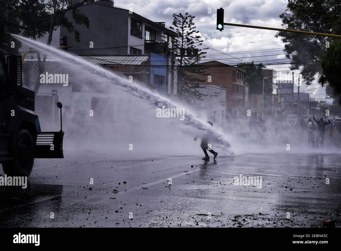 Students clash with riot police during a demonstration in Bogota ...