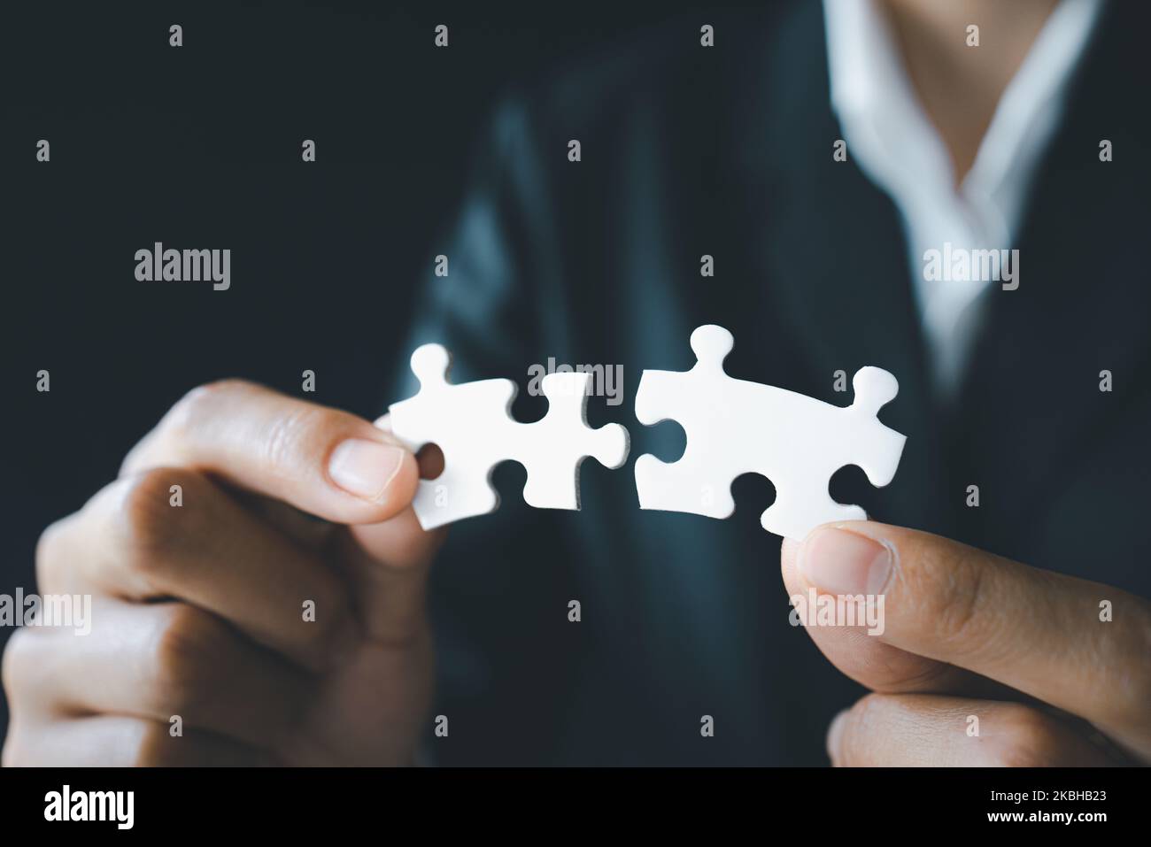 Business woman is trying to connect couple puzzle piece. Symbol of ... Business woman is trying to connect couple puzzle piece. Symbol of ...