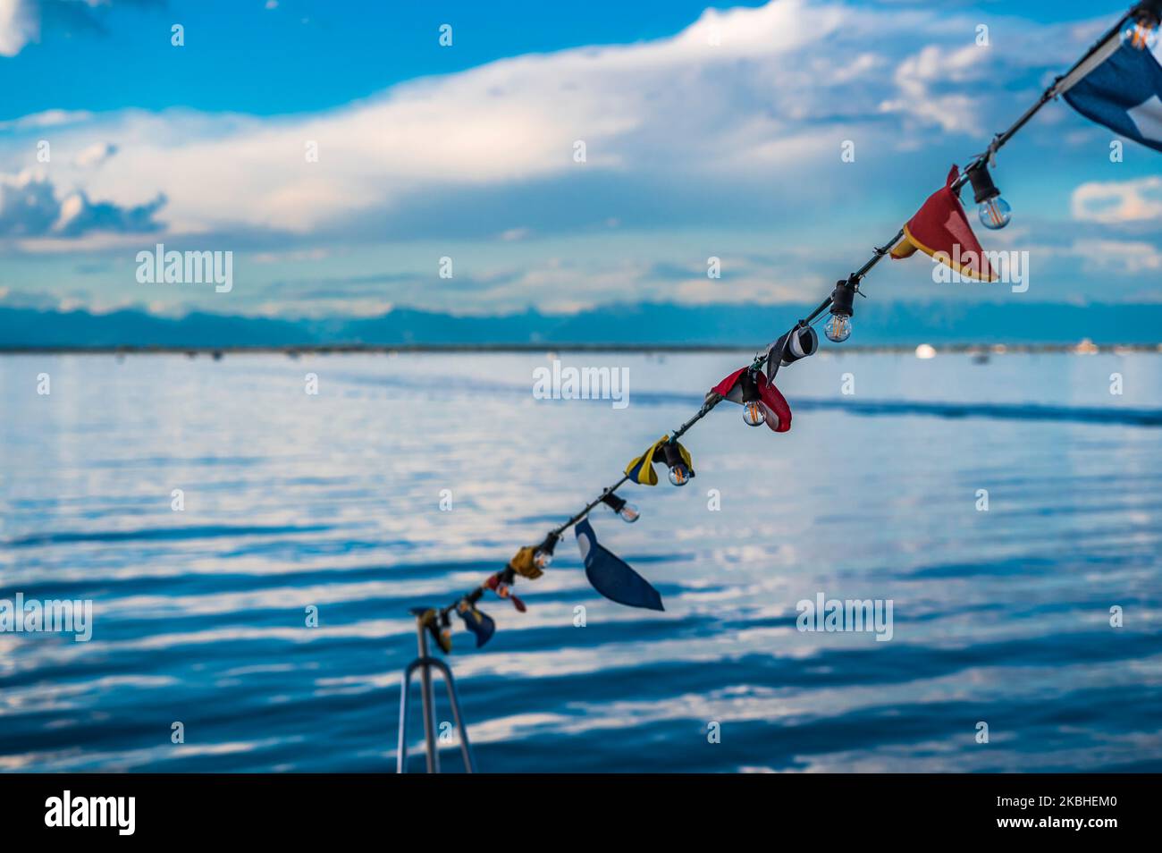 Towards the sunset. Marano lagoon late summer colors. Clouds and sun ...