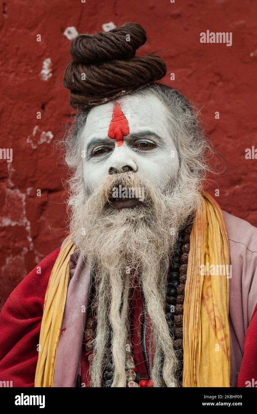 Hindu holy man (sadhus) with painted face is pictured at the ...