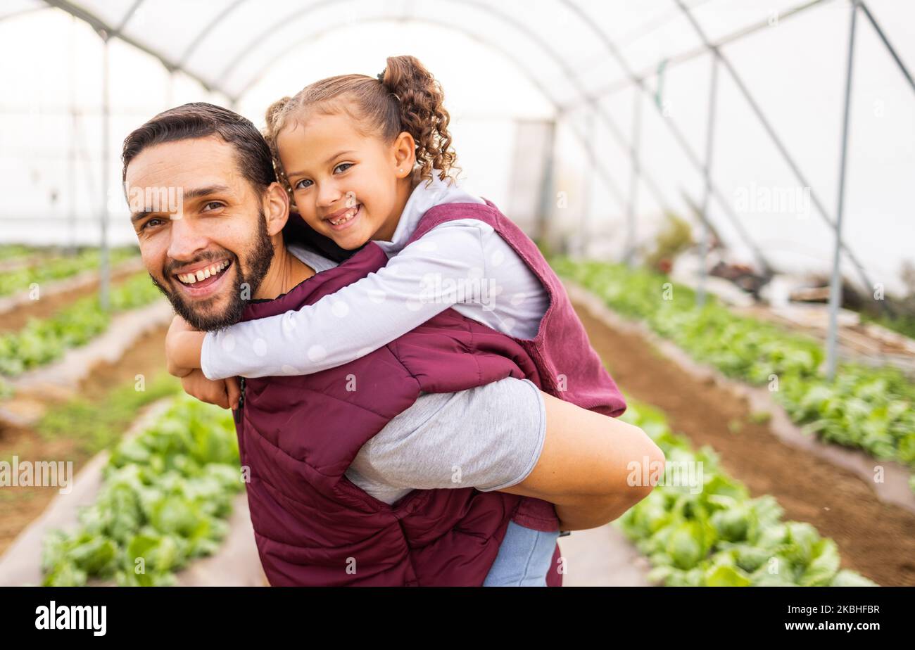 Greenhouse farmer, dad with girl and happy smile of girl getting ...