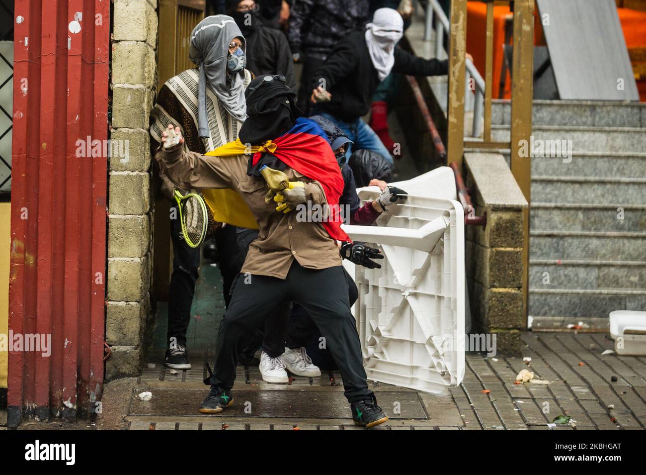 People clash with riot police during a protest in Bogota, Colombia, on ...