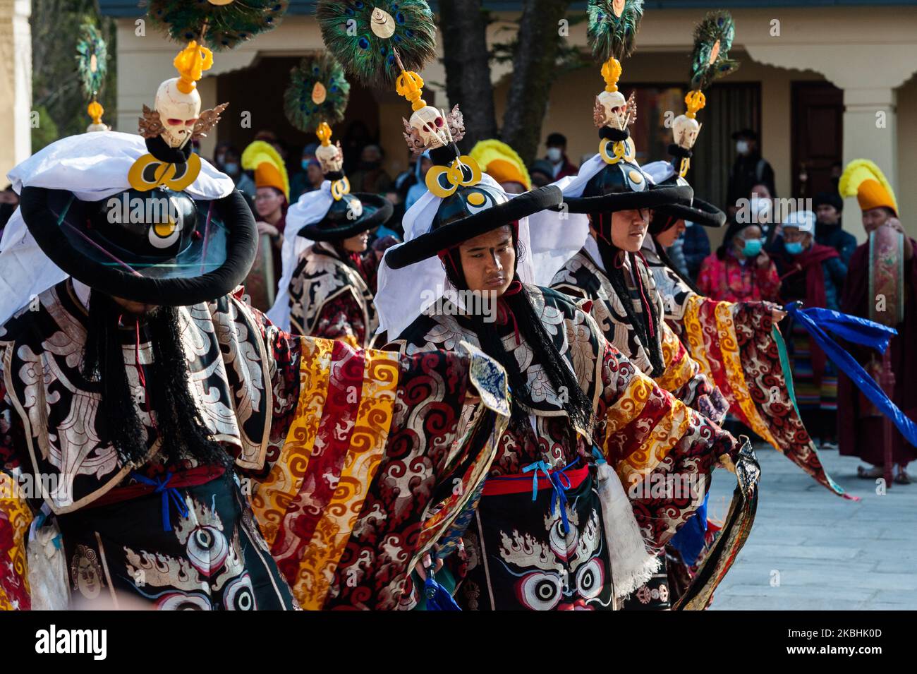 Tibetan monks in elaborate costumes perform the spiritual cham dance at ...