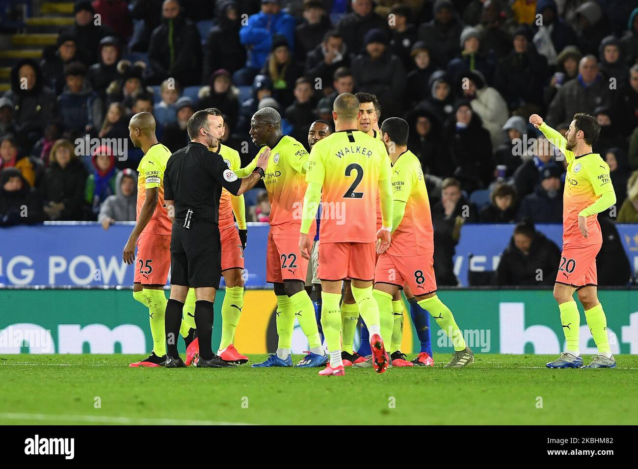 Manchester City players surround Referee Paul Tierney during the ...