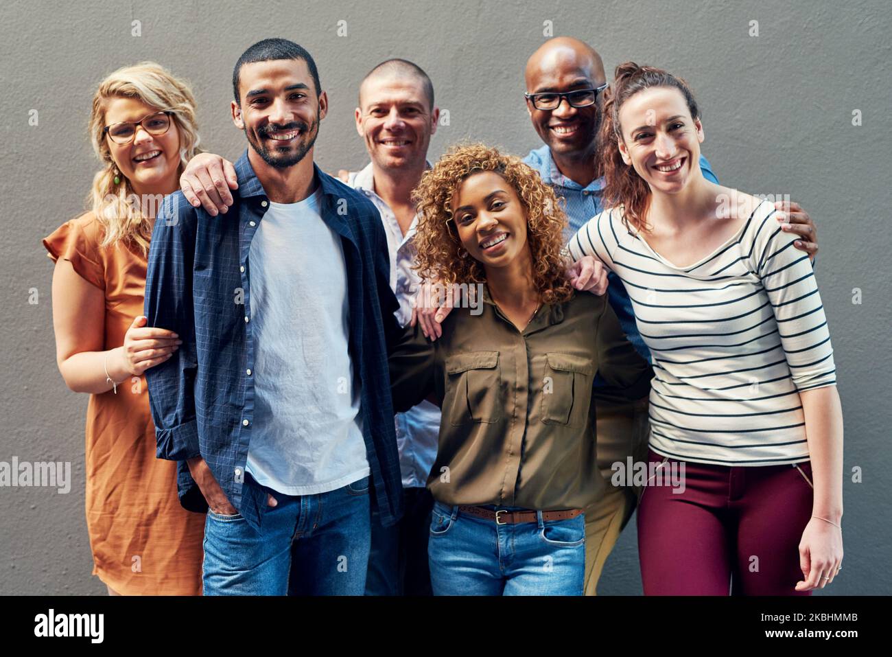 Group of people standing against wall hi-res stock photography and ...