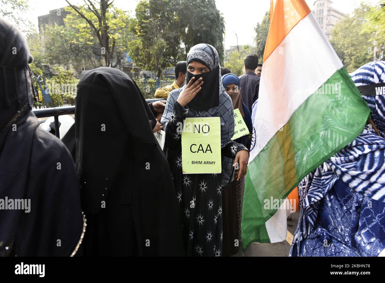 Members of Bhim Army, West Bengal, hold posters, banners and placards ...