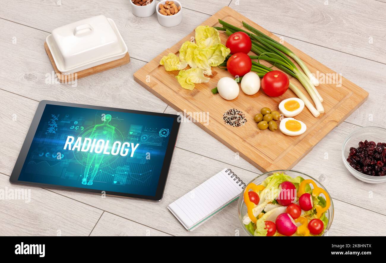 Tablet Pc with fruits, medical concept Stock Photo - Alamy