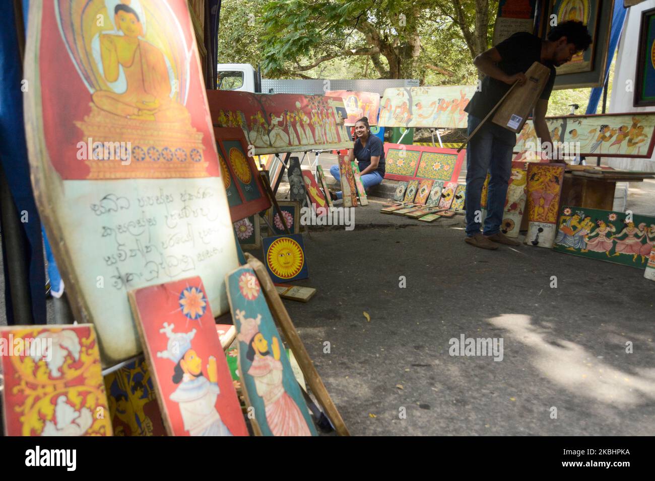A Sri Lankan artist displays his artwork at the annual 'Kala Pola' Art ...