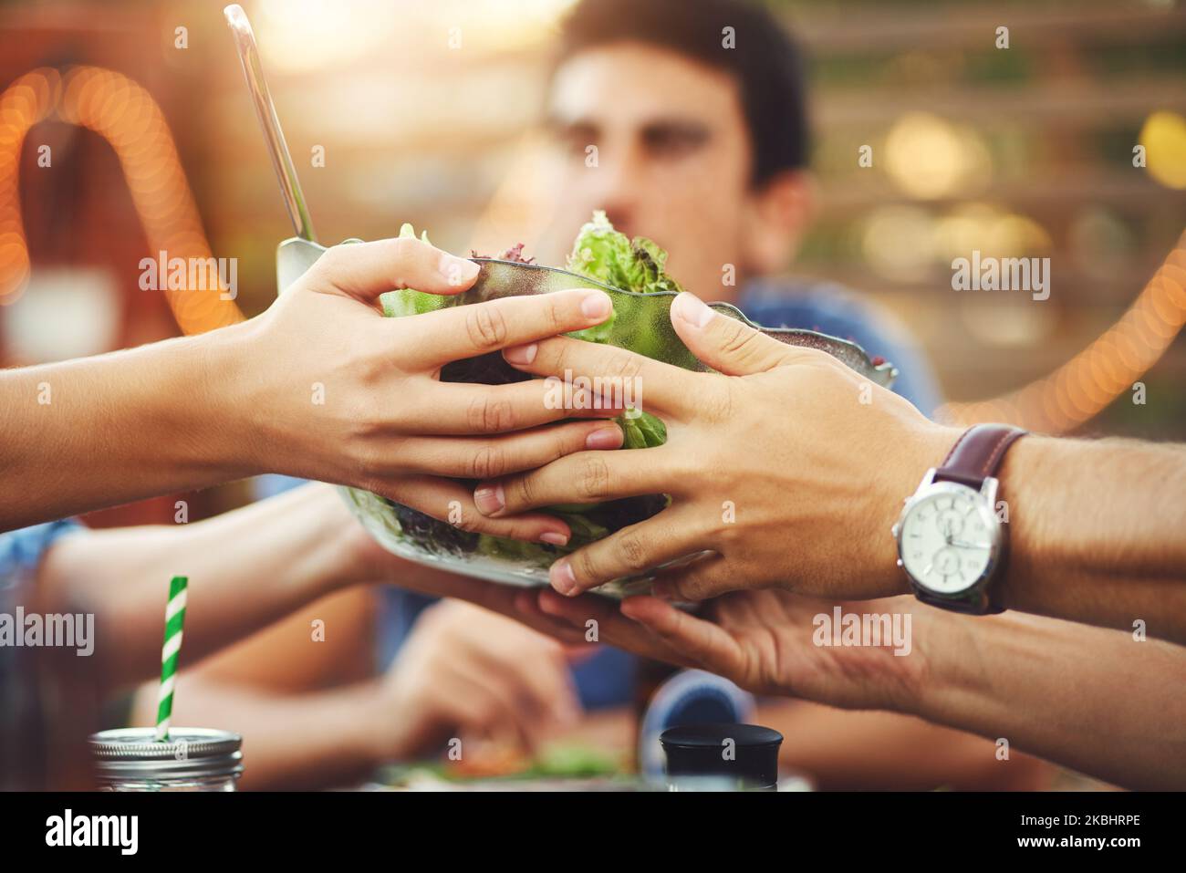 Adding some much needed greens to the meal. two unrecognizable friends ...