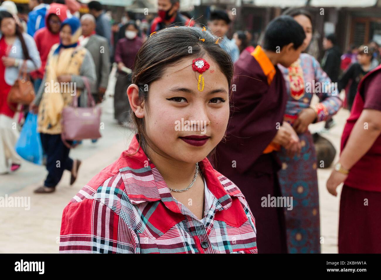 A young Nepali Bhotiya (Tibetan ethnicity) woman visits the Boudhanath ...