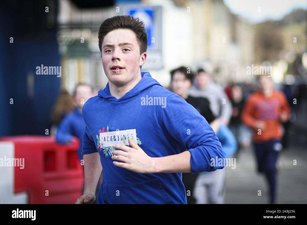 Boys chase after the leather ball during the annual game of hand ba ...