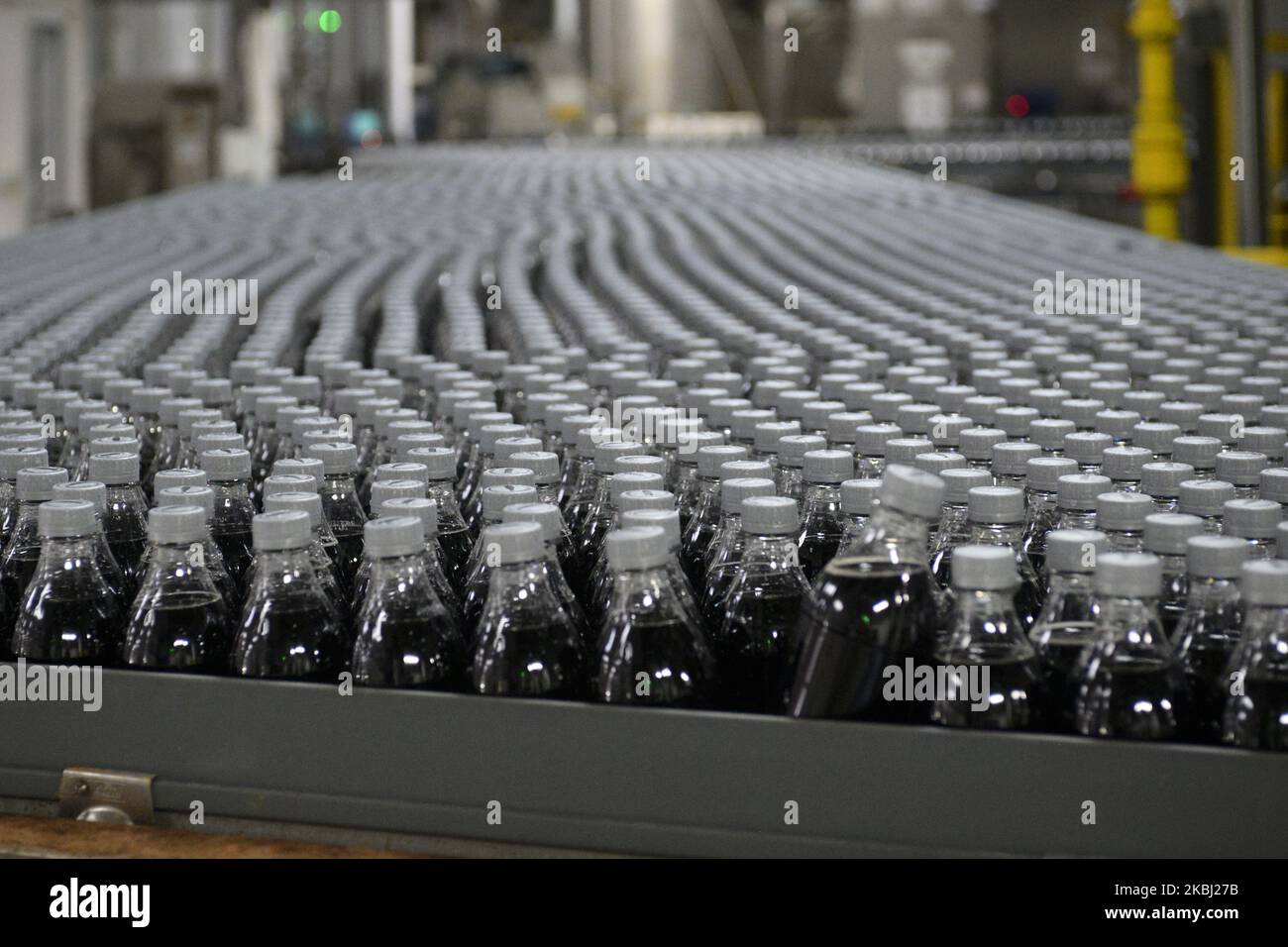 1.000 bottles a minute are transported by conveyer belts of three ...
