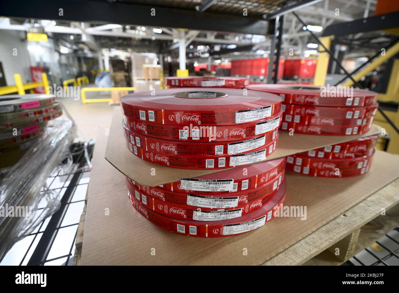 Labels for Coca-Cola products lay on a shelf in the bottling facility ...